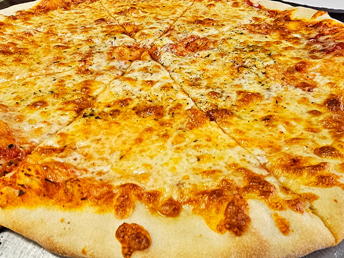Behold the star attraction: a cheese pizza so perfectly simple yet transcendent it makes you question why anyone would ever add toppings.