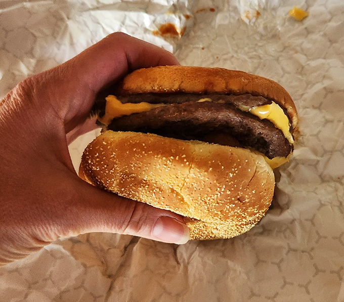 This isn't just a cheeseburger&mdash;it's edible architecture, where beef and melted American cheese create a symphony of savory perfection between two golden buns.