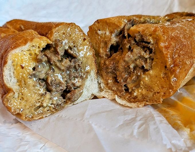 Cross-section of cheesesteak perfection. That golden river of Cheez Whiz embracing seasoned beef is what dreams are made of.