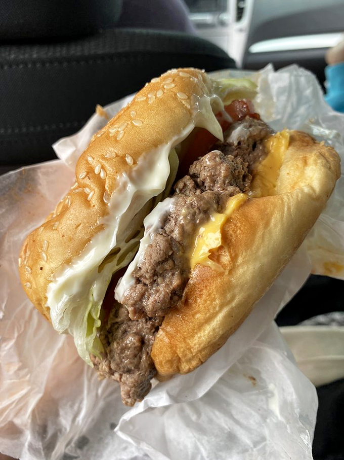 Behold the cheeseburger that could make a vegetarian question their life choices – pure beef bliss.