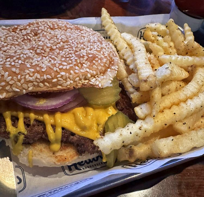 This isn't just a cheeseburger &ndash; it's a masterpiece of melty yellow cheese, crisp pickles, and a sesame bun that means business.
