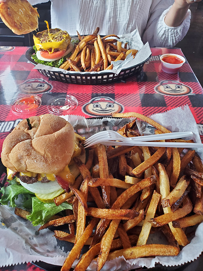 This isn't just a burger&mdash;it's edible architecture. Golden fries, melty cheese, and a perfectly toasted bun create the kind of meal that makes conversation stop mid-sentence.