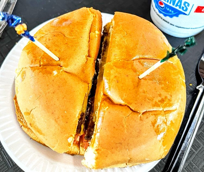 This isn't just a cheeseburger; it's a South Carolina handshake. Four quarters of pure, unpretentious bliss secured with colorful toothpicks.