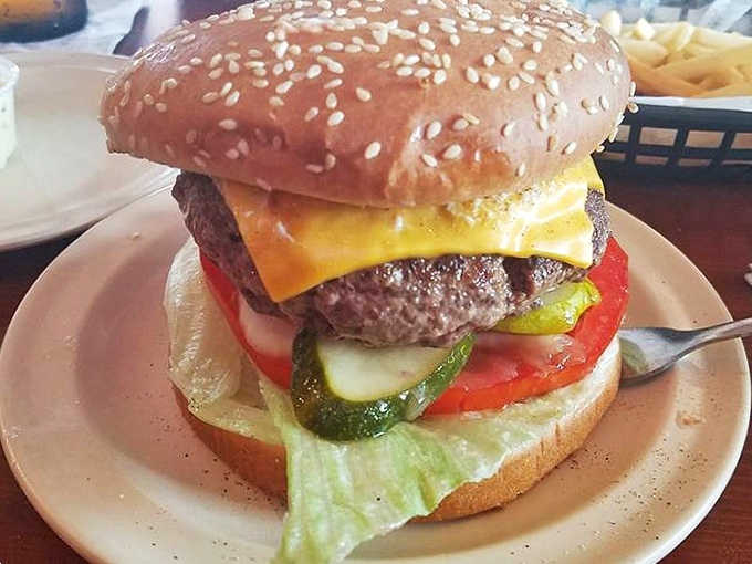 Behold the legendary World Champ in all its glory! This isn't just a burger; it's a masterpiece of beef, cheese, and fresh toppings on a perfectly toasted sesame bun. 