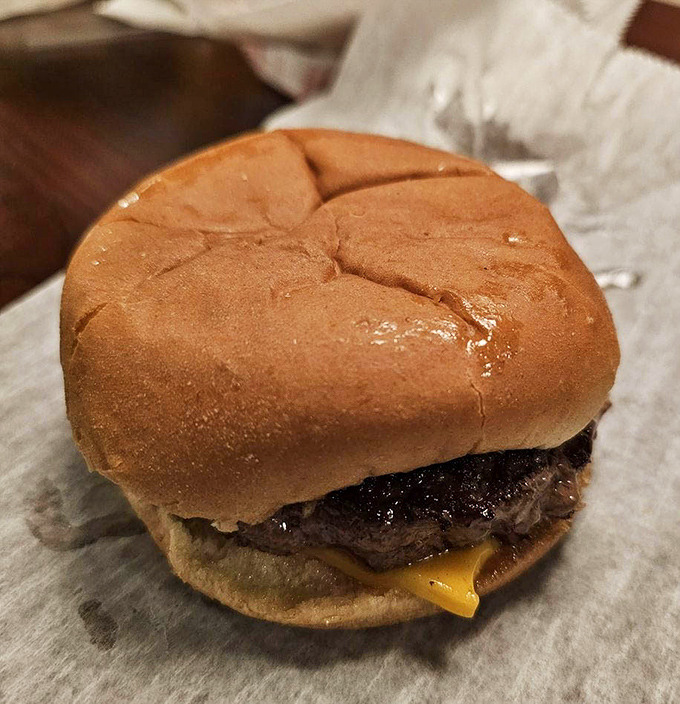 Behold the star of the show &ndash; a perfectly grilled burger with melted cheese on a soft bun. No Instagram filters needed for this beauty.