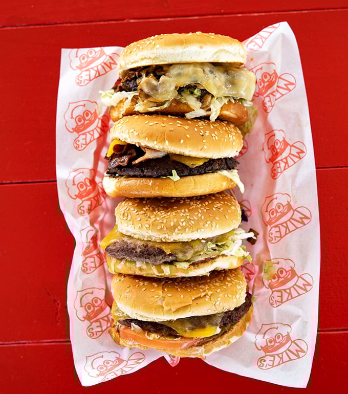 Mike's burgers stack up like a delicious skyscraper of beef, cheese, and veggies&mdash;architectural masterpieces you can actually eat.