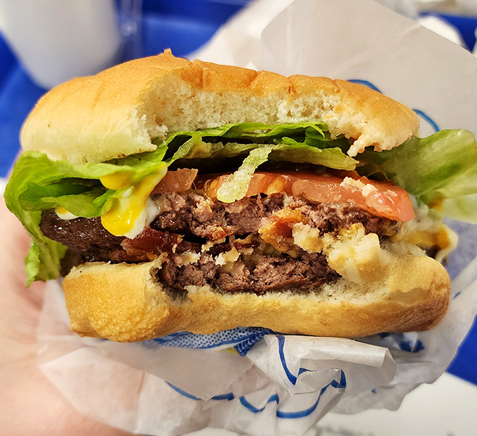 This isn't just a burger; it's edible architecture. The perfect ratio of meat to toppings creates a handheld masterpiece worthy of the Louvre.