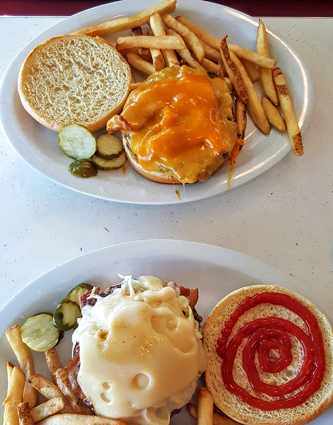 Behold the cheeseburger in its natural habitat&mdash;surrounded by golden fries and pickle spears. A masterpiece of American cuisine.