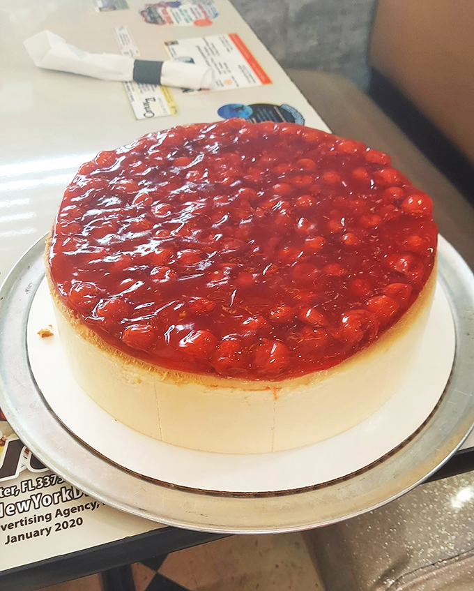 Behold the strawberry cheesecake in all its glory – a dessert so photogenic it probably has its own Instagram following.