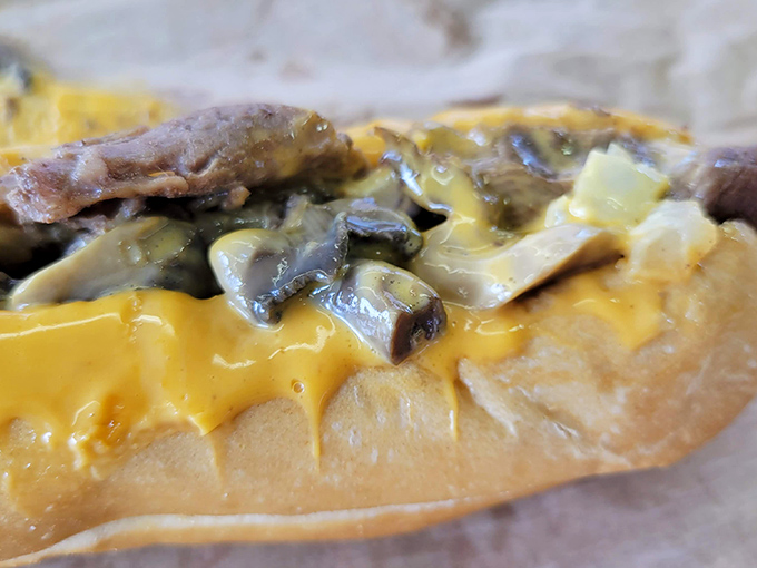 Cheese cascading over thinly sliced beef like a dairy waterfall of dreams. This is what Philadelphia tastes like, friends.