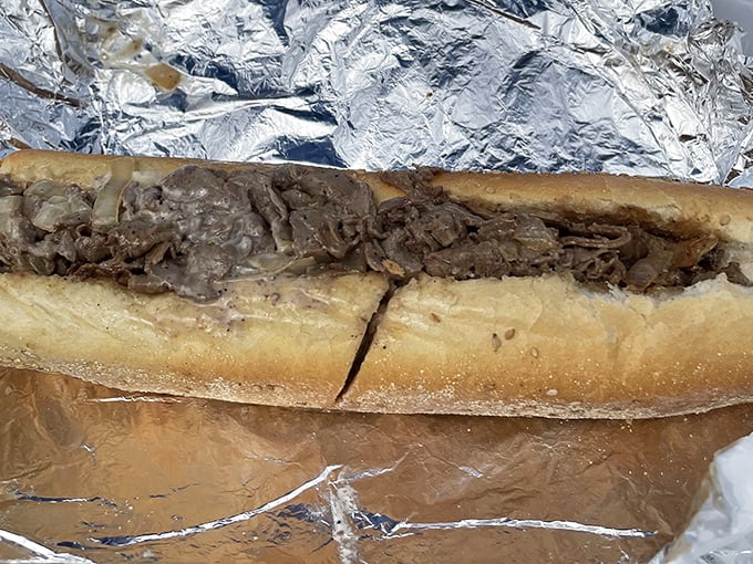 Behold the humble cheesesteak in its natural habitat—wrapped in foil, ready to transport you to a higher plane of existence with each savory bite.