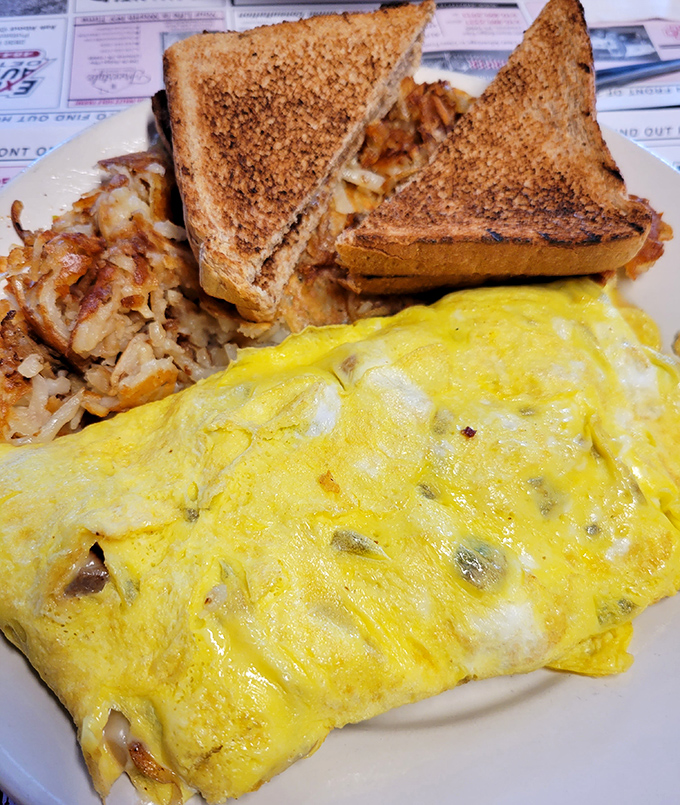 Behold the star attraction &ndash; a perfectly executed omelet bursting with cheesesteak filling that bridges Philadelphia tradition with breakfast innovation.