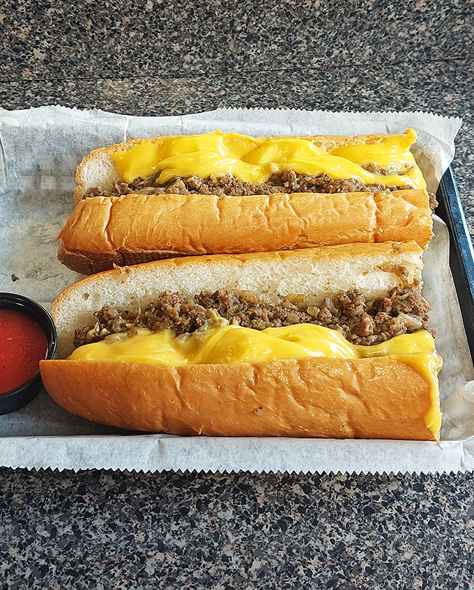 Behold the star attraction: Speed's cheesesteak in all its glory. That perfect cheese-to-meat ratio isn't an accident&mdash;it's sandwich engineering at its finest.