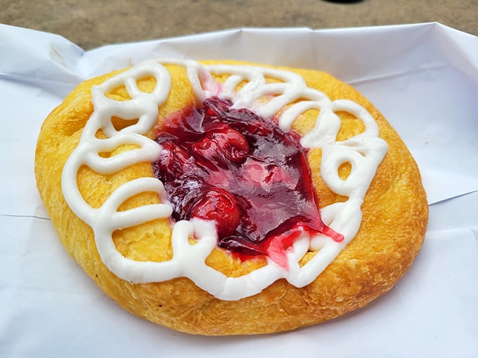 This cherry danish isn't just breakfast&mdash;it's edible artwork. The glossy fruit center surrounded by vanilla drizzle creates a sunrise on your taste buds.