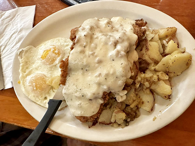 That's not just chicken fried steak&mdash;it's a blanket of country gravy protecting crispy perfection underneath.