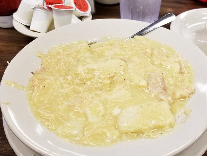 Behold the legendary chicken and dumplings—a creamy, steaming bowl of Southern comfort that makes you want to hug whoever's in the kitchen.
