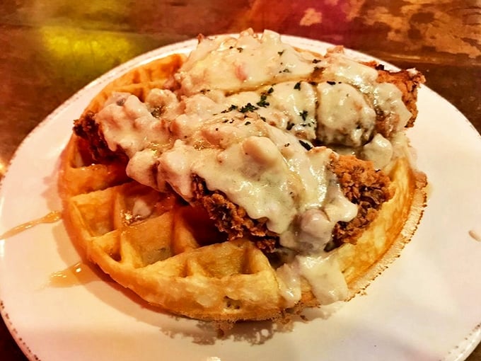 The headliner act: golden Belgian waffle crowned with crispy hand-breaded chicken, smothered in country gravy&mdash;a sweet-savory symphony that deserves a standing ovation.