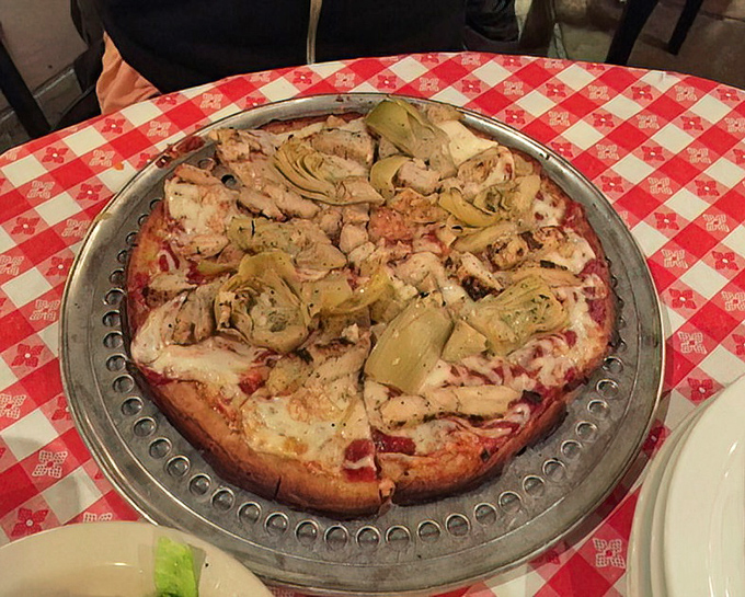 When artichokes meet chicken on pizza, it's like watching two perfect strangers become best friends.