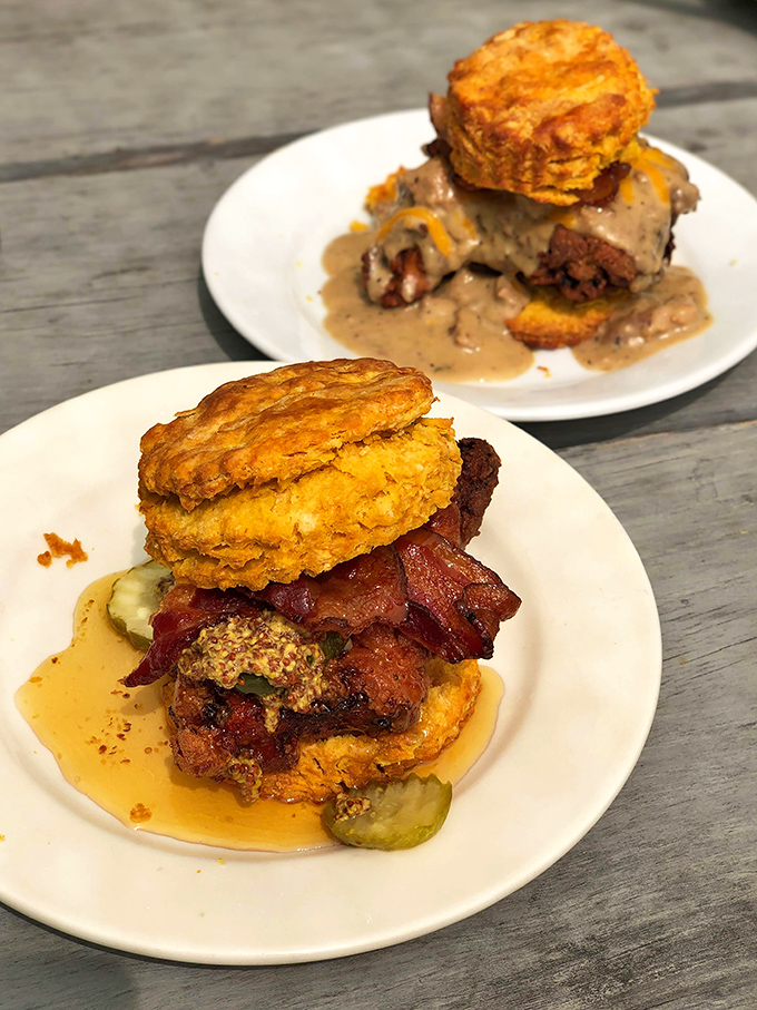 Behold the architectural marvel that is their signature biscuit sandwich. Golden-hued sweet potato biscuits cradle fried chicken and bacon in perfect harmony.