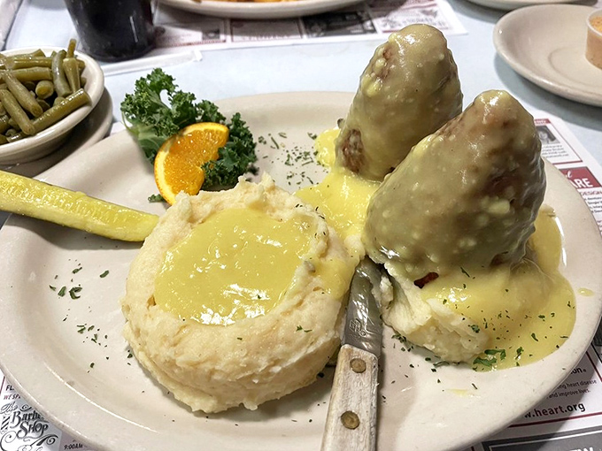 Chicken croquettes swimming in golden gravy—comfort food that would make your grandmother both proud and jealous of their perfect execution.