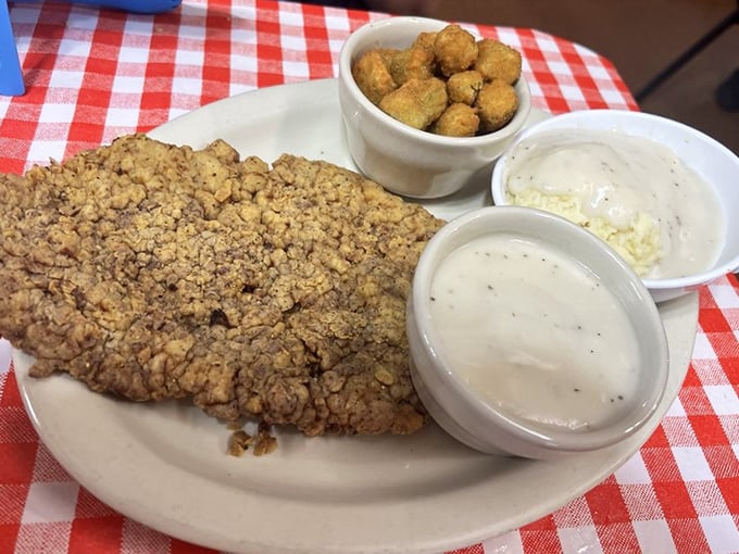 This chicken fried steak isn't just dinner&mdash;it's an edible monument to Southern cooking. The cream gravy alone deserves its own fan club.