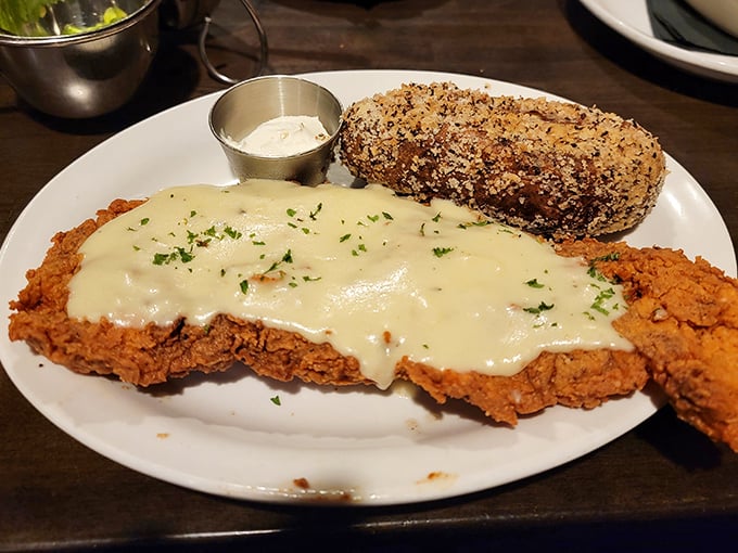 Chicken fried steak smothered in gravy that your arteries fear but your soul craves. Comfort food that hugs you from the inside.