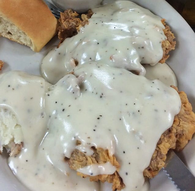 Behold the crown jewel: chicken fried steak smothered in peppery cream gravy. This isn't just food&mdash;it's edible therapy.