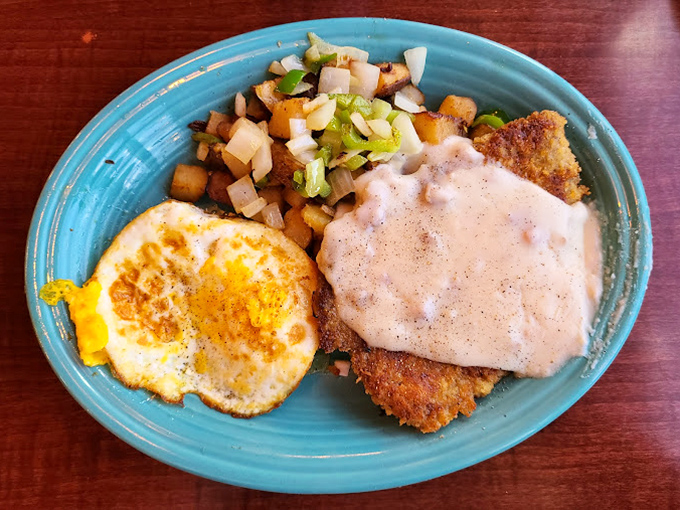 Behold the star attraction: chicken fried steak with country gravy, perfectly crisp exterior giving way to tender meat beneath.