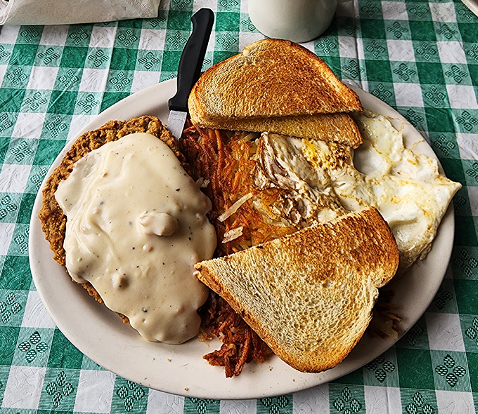 The legendary chicken fried steak in all its gravy-smothered glory, where crispy exterior meets tender meat in perfect harmony.