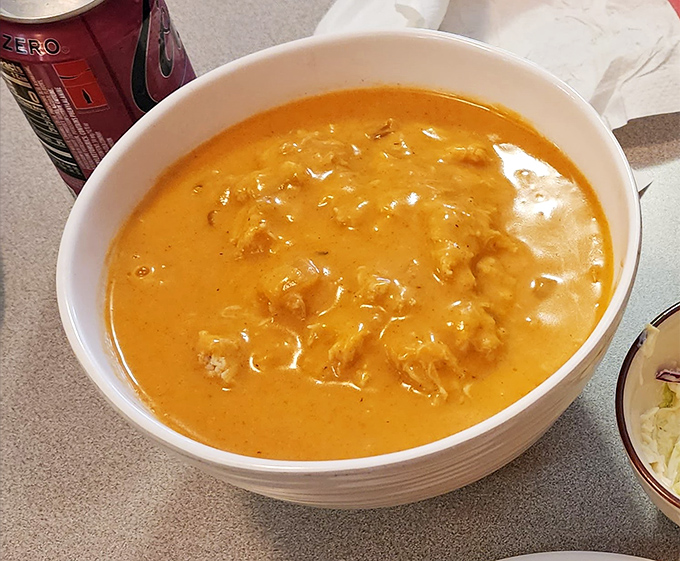 This isn't just chicken paprikash—it's a sunset-colored pool of paprika-kissed comfort that demands to be savored one heavenly spoonful at a time.