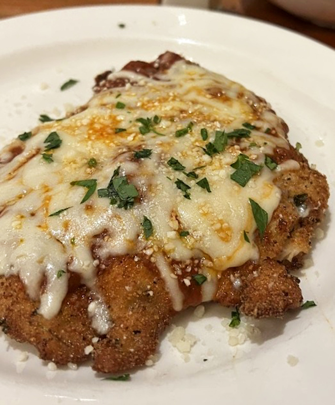 Behold the star of the show &ndash; golden-brown, cheese-blanketed chicken parm that makes resistance utterly futile.