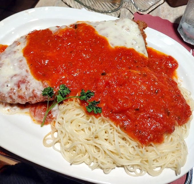 The legendary chicken parm in all its glory&mdash;where marinara meets mozzarella in a romance that would make Shakespeare weep with hunger.