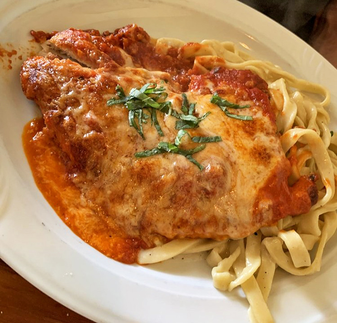 Behold the chicken parmigiana that launches a thousand return visits&mdash;perfectly crisp exterior, molten cheese, and that marinara sauce you'll dream about later.