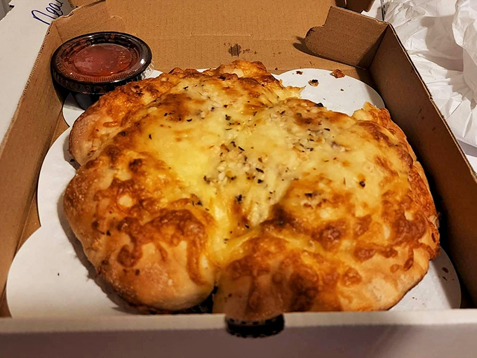 This chicken pot pie doesn't just break the rules of what a pizza place should serve—it rewrites them with a golden, flaky pen.