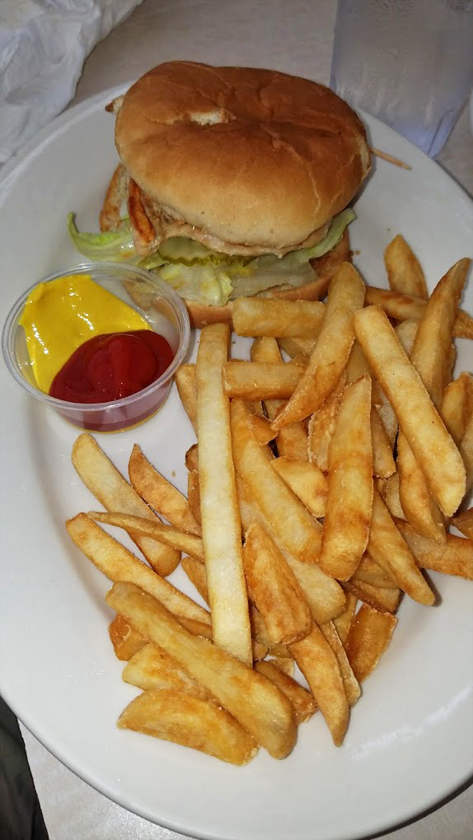 A proper diner burger doesn't need fancy aioli or artisanal buns&mdash;just honest ingredients stacked high enough to require a strategic approach.