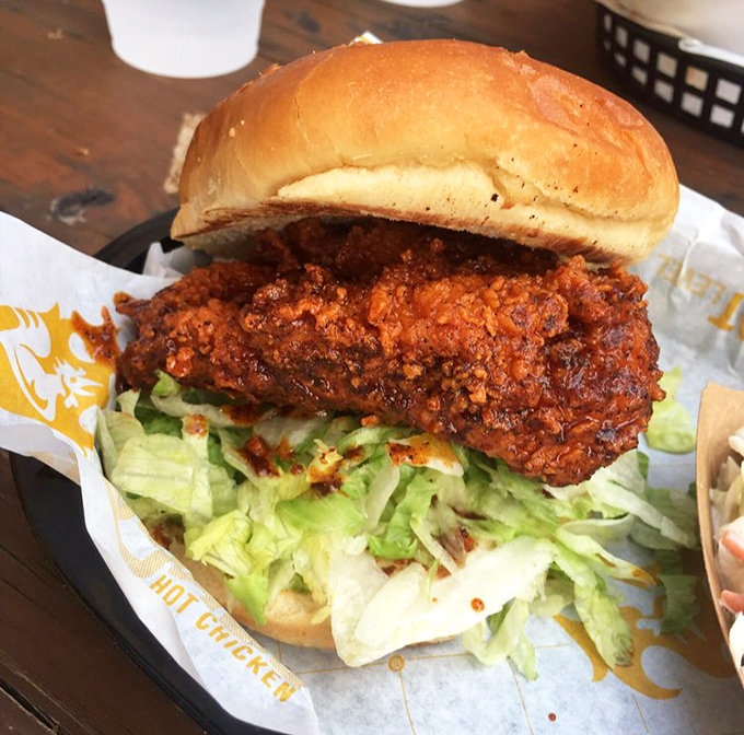 Behold the crown jewel: a hot chicken sandwich that makes other sandwiches question their life choices. That color isn't just spice&mdash;it's personality.