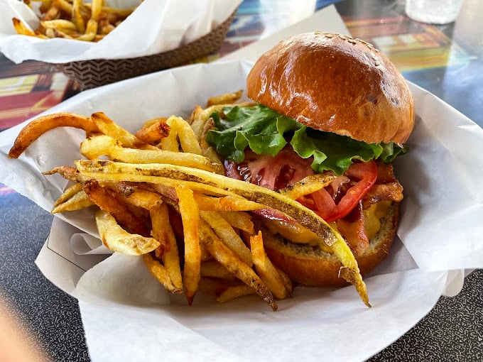 This isn't just a burger&mdash;it's edible architecture. Notice how the golden bun domes perfectly over those fresh veggies like a Renaissance painting.