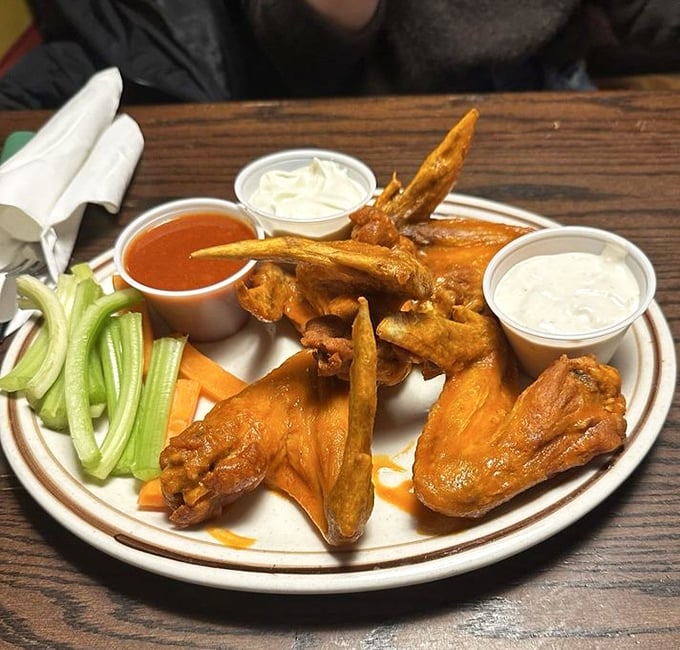 These wings aren't just served&mdash;they're presented like the celebrities they are. The sauce-to-meat ratio here is what mathematicians call "perfect."