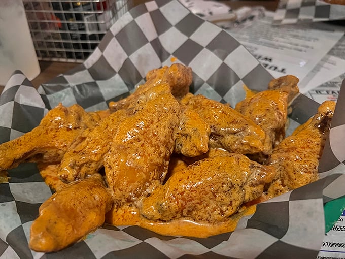 These wings aren't just served&mdash;they're presented like the celebrities they are. Golden-brown, sauce-slathered perfection that makes napkins necessary and diets optional.