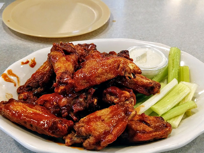 These wings aren't just food; they're a religious experience with crispy skin, tender meat, and sauce that should be bottled and sold.