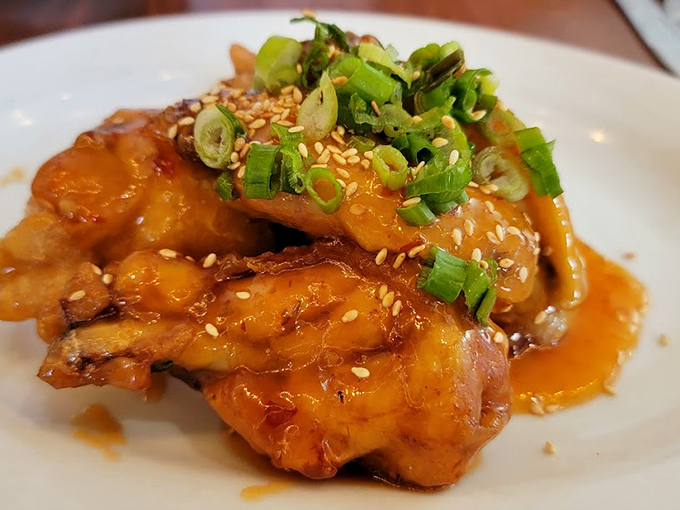 These aren't just wings; they're a masterclass in texture and flavor. The sweet chili glaze glistens like edible jewelry.