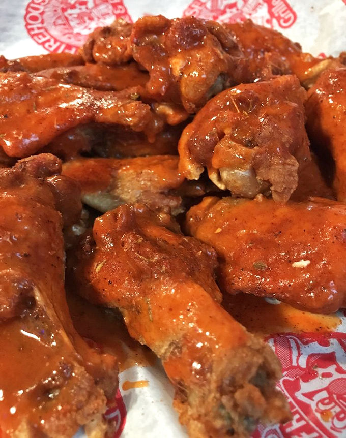 These aren't just wings; they're crispy, saucy masterpieces that explain why people drive from counties away for a proper wing fix.