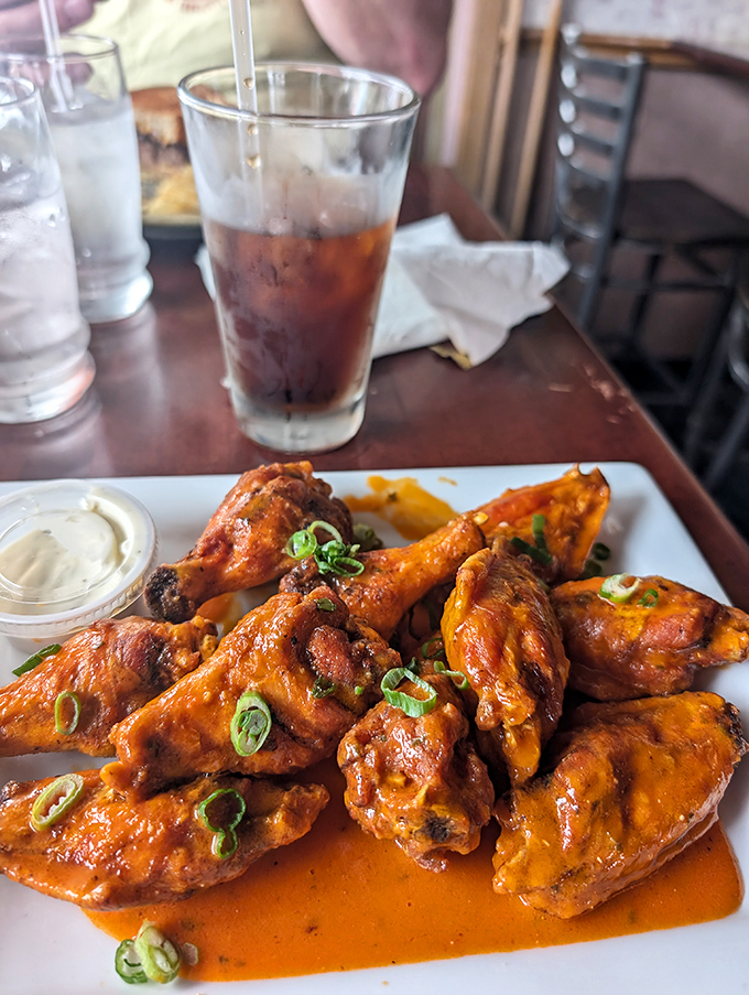 The star attraction arrives! These wings, glistening with sauce and garnished with scallions, aren't just food&mdash;they're an Ohio religious experience.