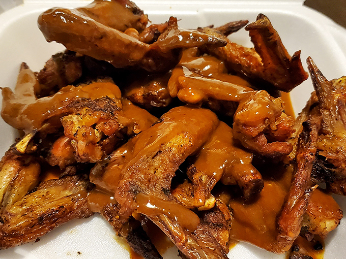 These wings aren't just coated in sauce; they're having a full-on flavor romance with it. Each one glistens with that perfect sticky-sweet embrace.