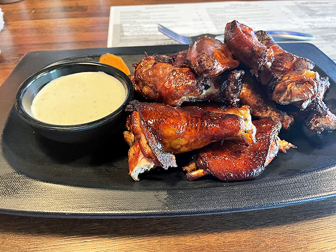 These wings aren't just smoked, they're transformed &ndash; glistening with caramelization and served with a sauce so good you'll contemplate drinking it straight.