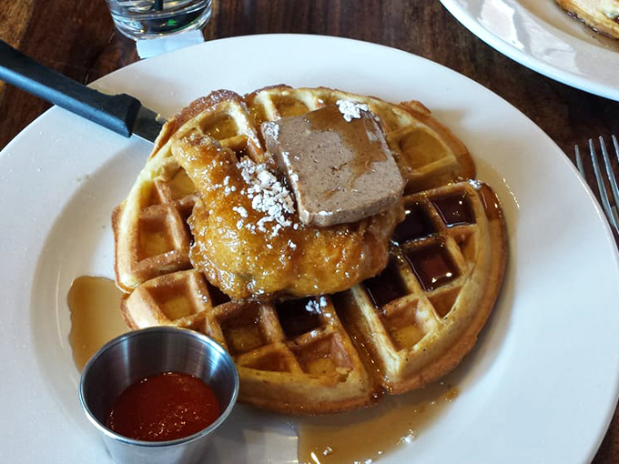 Behold the holy grail of brunch: golden waffles crowned with perfectly fried chicken and pure maple syrup bliss.