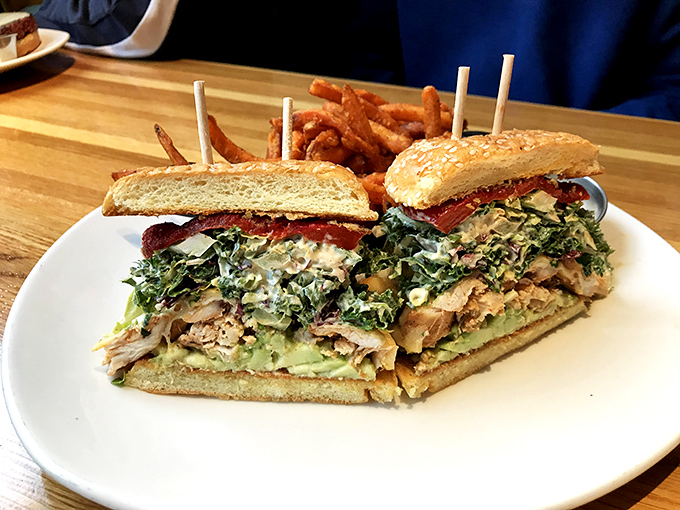 This isn't just a sandwich; it's architecture with avocado mortar and chicken foundation, held together by the laws of delicious physics.