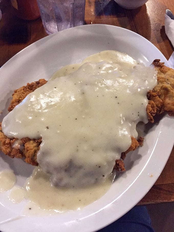 Behold the holy grail of Texas cuisine: chicken fried steak smothered in peppery cream gravy so good you'll want to bottle it and take it home.