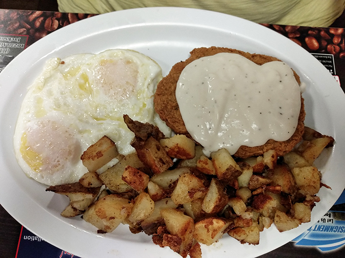 Comfort on a plate! That golden-brown chicken fried steak with creamy gravy is what breakfast dreams are made of.