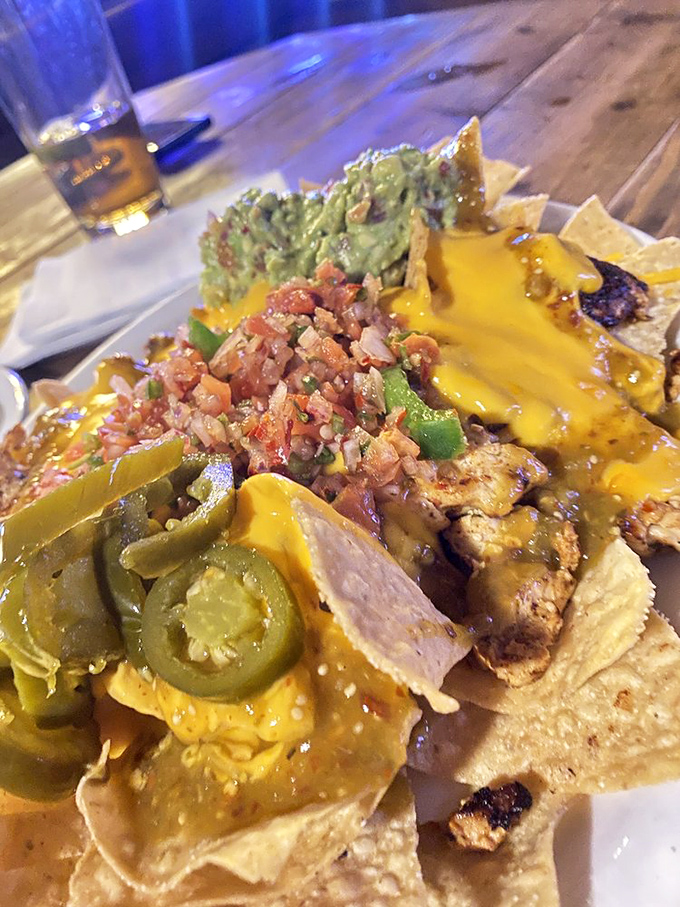 Loaded nachos that don't skimp on toppings &ndash; a mountain of melted cheese, fresh salsa, and guacamole that requires a strategic eating plan.